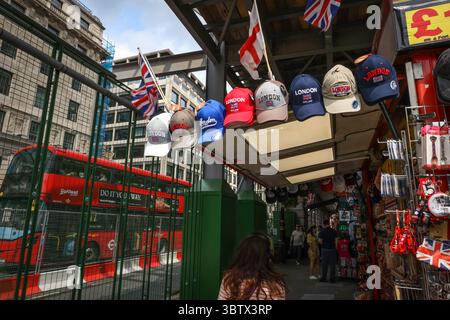 A row of London Baseball Caps at a tourism souvenir stall next to the ...