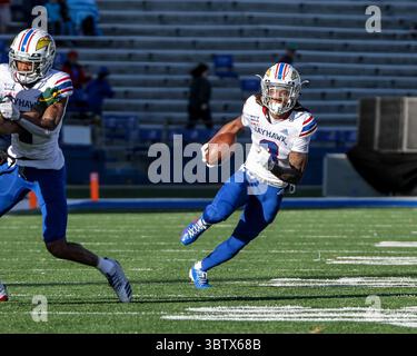 Kansas wide receiver Kwamie Lassiter II (8) is tackled by Oklahoma ...