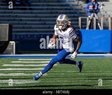 Kansas wide receiver Kwamie Lassiter II (8) is tackled by Oklahoma ...