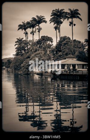 Sepia-toned reflection of historic waterfront buildings in the calm ...