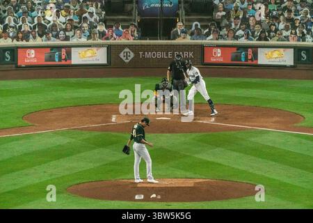 Seattle Mariners Kyle Lewis bats against the texas Rangers during a ...