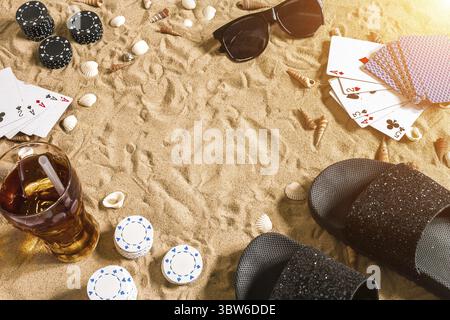 Beachpoker. Chips and cards on the sand with seashells. Top view Stock ...