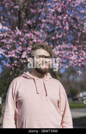 Spring seasonal allergy concept with happy dog running among blooming ...