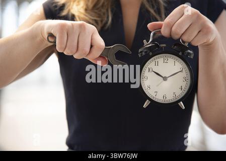Shocked woman with alarm clock on color background Stock Photo - Alamy