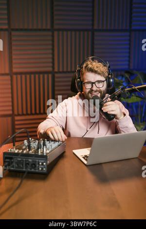 Radio host concept - Handsome man working as radio host at radio ...