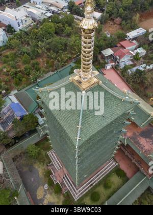 Aerial view of a pagoda standing tall amidst the snowy landscape ...