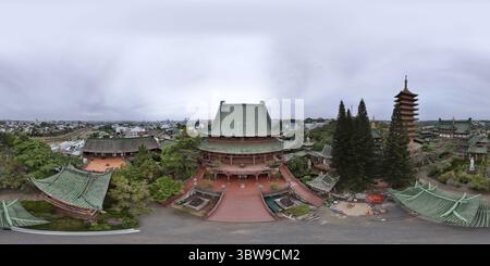 Aerial view of Minh Thanh Pagoda's majestic tower piercing the skyline ...