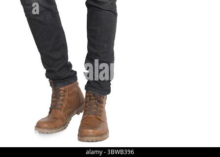 Lower half of Man leg and foot wearing jeans and shoes on isolated ...