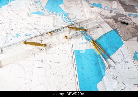Maps of the ship for plotting. Plotter, divider, ruler and pen. Close ...