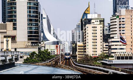 A BTS Skytrain travels through central Bangkok, Thailand, elevated ...