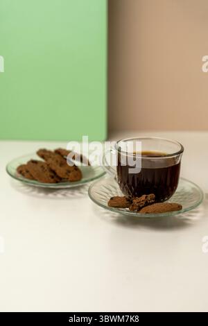 Glass cup of coffee and Chocolate chip cookies on the table Stock Photo ...