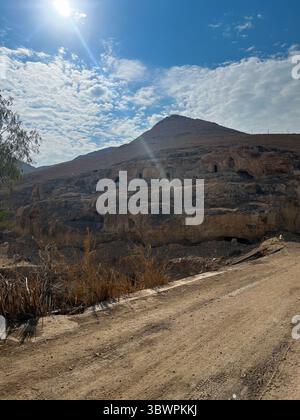Bright Cloudy Rock and Hills Landscape Stock Photo - Alamy