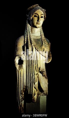 Marble kore statue depicting a young woman, characteristic of Archaic ...