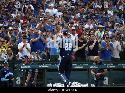 Fans cheer for Cubs starting pitcher Kyle Hendricks as he exits the ...