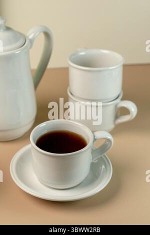 a beige ceramic cup on a cozy warm background indoors Stock Photo - Alamy