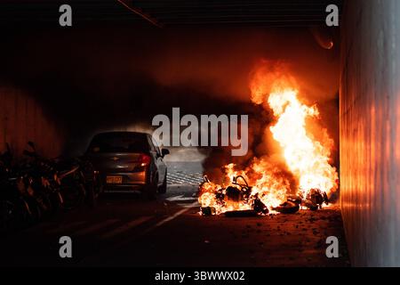 A set of riot police motorbikes burnt during a new day of anti ...