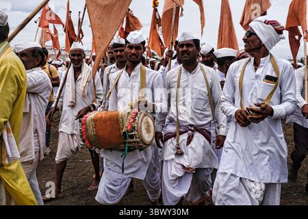 Devotees participate in the vibrant Wari Palki Yatra at Pandharpur, a ...