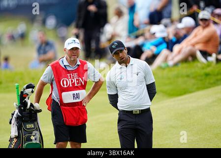 Caddie Jason Timmis and England's Aaron Rai on the 10th green on day ...