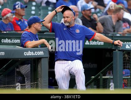 Chicago Cubs' David Ross stands in the dugout during a baseball game ...