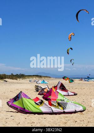 Colorful kites at the coast of the atlantic ocean in Tarifa, a popular ...
