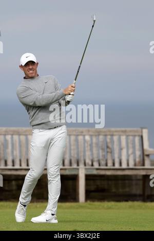 Rory McIlroy of Northern Ireland plays his second shot on the 18th hole ...