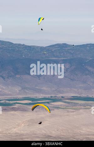Four paragliders soar over the Sevier Valley with the Pahvant Range in ...
