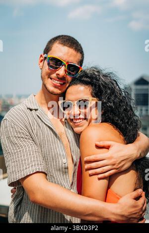 love couple rooftop hug happiness emotion Stock Photo - Alamy