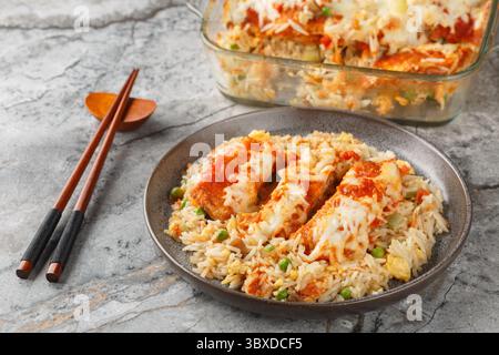 Baked pork with carrot sauce and fried onion Stock Photo - Alamy