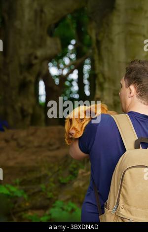 Young man with cocker spaniel Stock Photo - Alamy