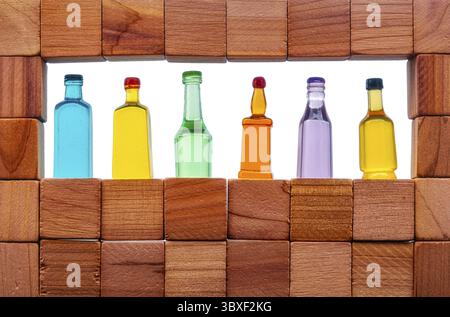 various miniature bottles of alcohol without labels with black ...