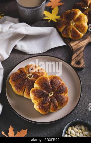 Pumpkin spice bread buns, shaped like small pumpkins and tied with ...
