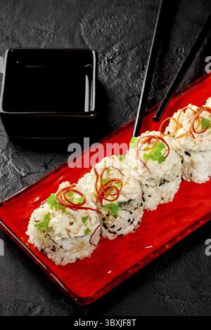 Exquisite sushi rolls with creamy seafood caps on black Stock Photo - Alamy