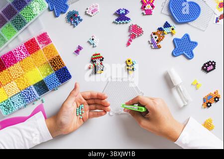 Girl makes pattern top view Stock Photo - Alamy