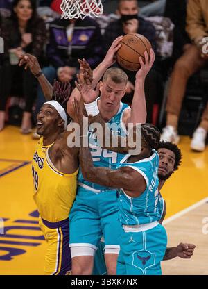 Charlotte Hornets center Mason Plumlee, front, tries to take the ball past Oklahoma City Thunder ...