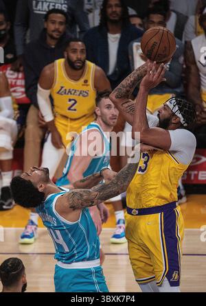 Charlotte Hornets center Nick Richards, left, shoots in front of ...