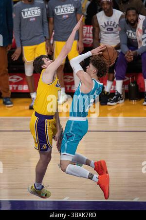 Charlotte Hornets' Lamelo Ball tries to get past Milwaukee Bucks' AJ ...