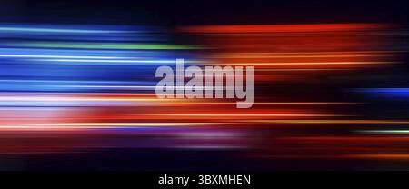 Abstract Rainbow light trails on the dark blue background. Motion blur ...