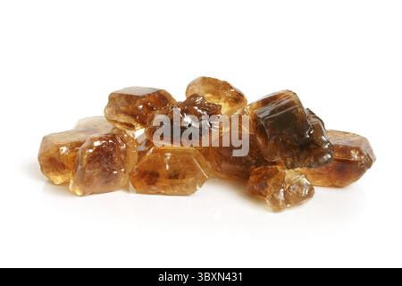 Large caramelized sugar on a white background Stock Photo - Alamy