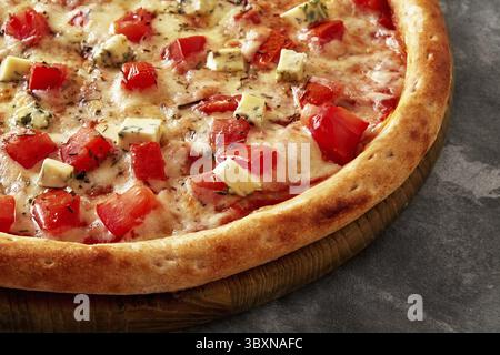 Delicious fragrant pizza with mozzarella, tomatoes and basil with ...