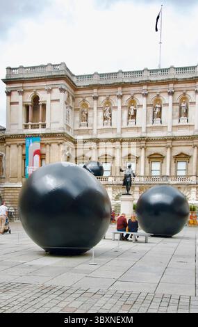 Courtyard installation by Ryan Gander inflatable black balls with ...