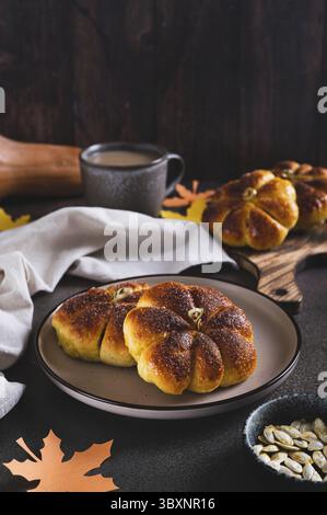 Pumpkin spice bread buns, shaped like small pumpkins and tied with ...