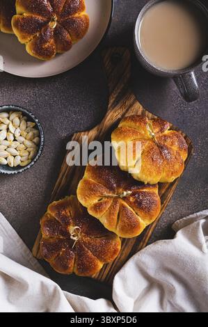 Pumpkin spice bread buns, shaped like small pumpkins and tied with ...
