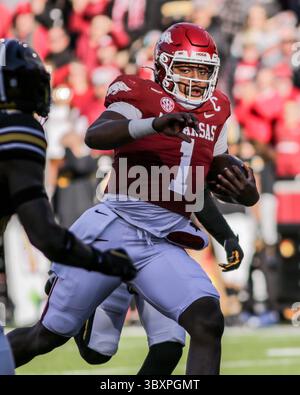 Arkansas quarterback KJ Jefferson scrambles during the first half of an ...