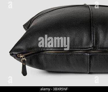 Close-up of a cushion made from a white linen tea towel with a striped ...