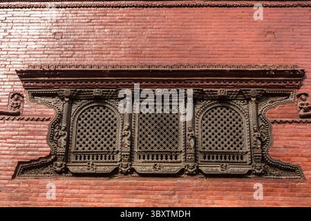 Elaborately carved wooden windows in the traditional Newar style ...
