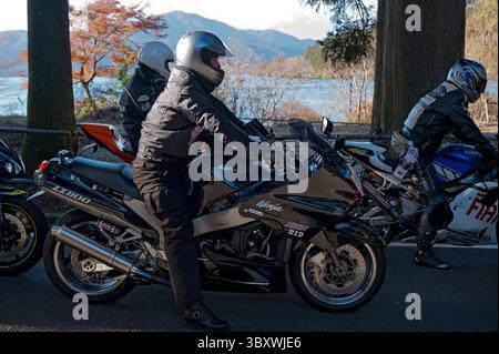 Group of Japanese motorcycle enthusiasts decked out in fashionable ...