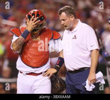 Chicago Cubs' Carson Kelly, left, is tagged out by Baltimore Orioles ...