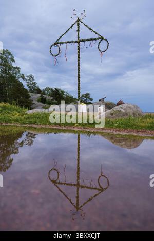 Maypole decorated with flowers in celebration of Midsummer's Day ...
