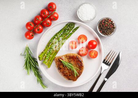 Appetizing beef steak with asparagus on plate Stock Photo - Alamy