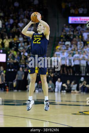 West Virginia guard Sean McNeil advances the ball against Baylor during ...